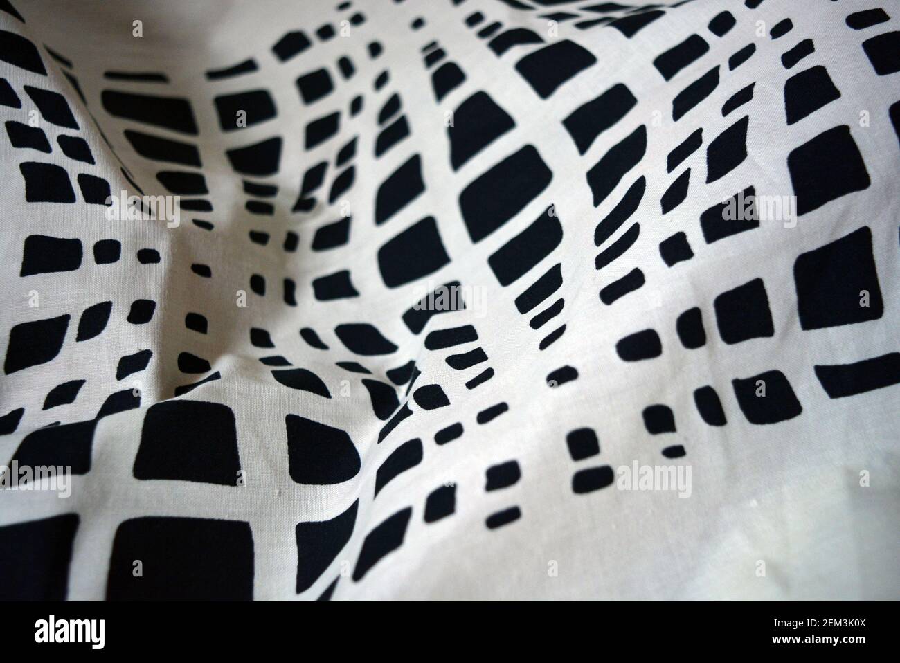 Ivory cotton fabric with geometric patterns printed on it. Unusual ...