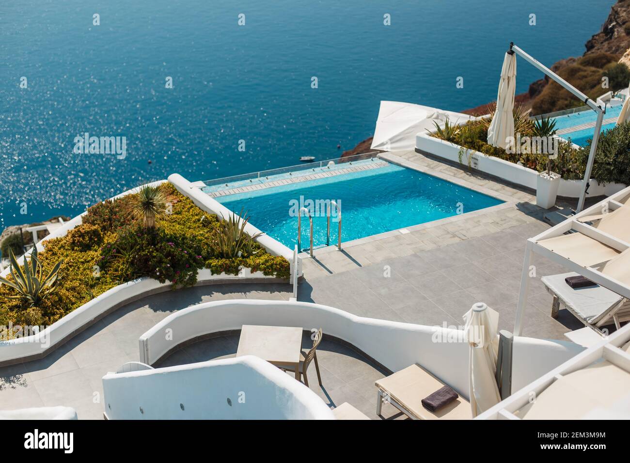 Blue swimming pool on Santorini island in Greece. Amazing pool ...