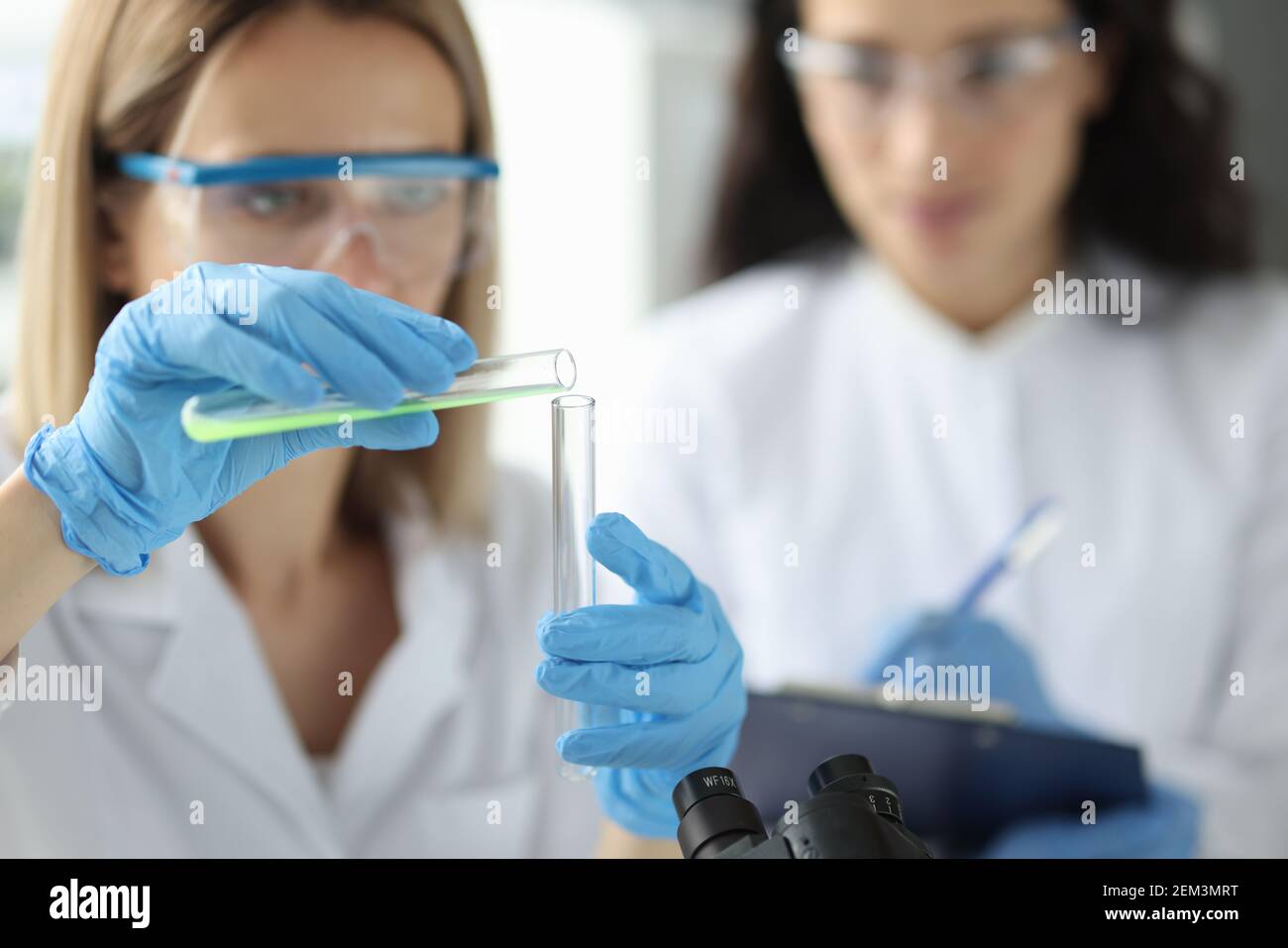 Scientists in laboratory are conducting chemical experiments Stock ...