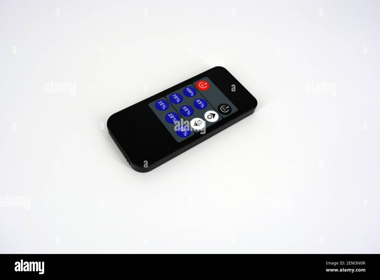 Black plastic radio remote control on batteries with colored buttons ...