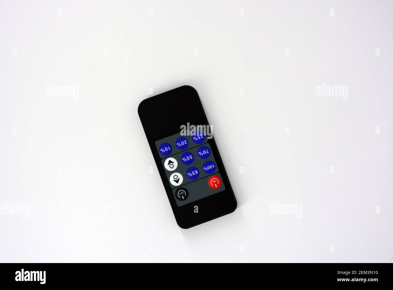 Black plastic radio remote control on batteries with colored buttons ...