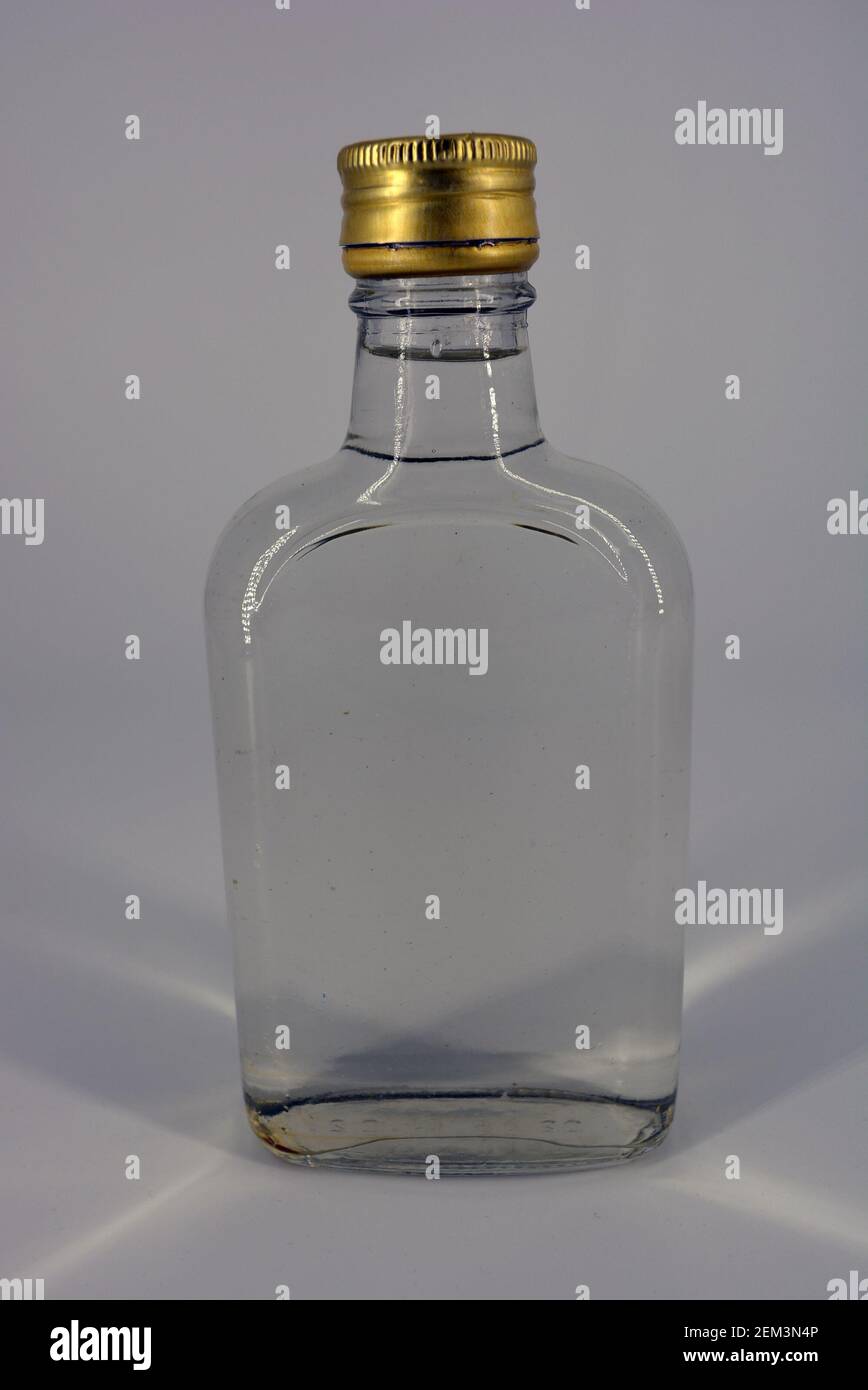Classic glass bottle of 500 ml with swelling neck and gilded lid for ...