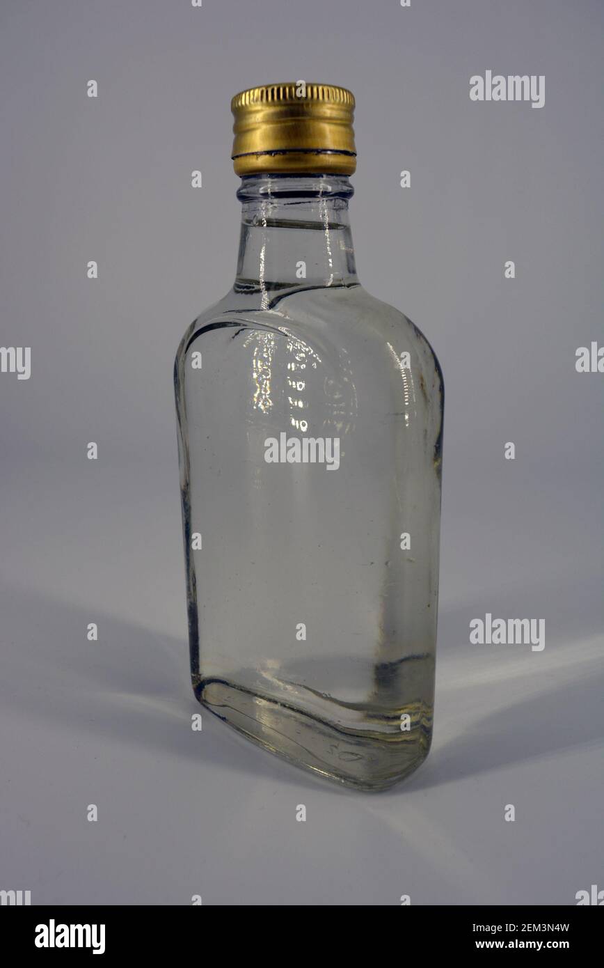 Classic glass bottle of 500 ml with swelling neck and gilded lid for ...