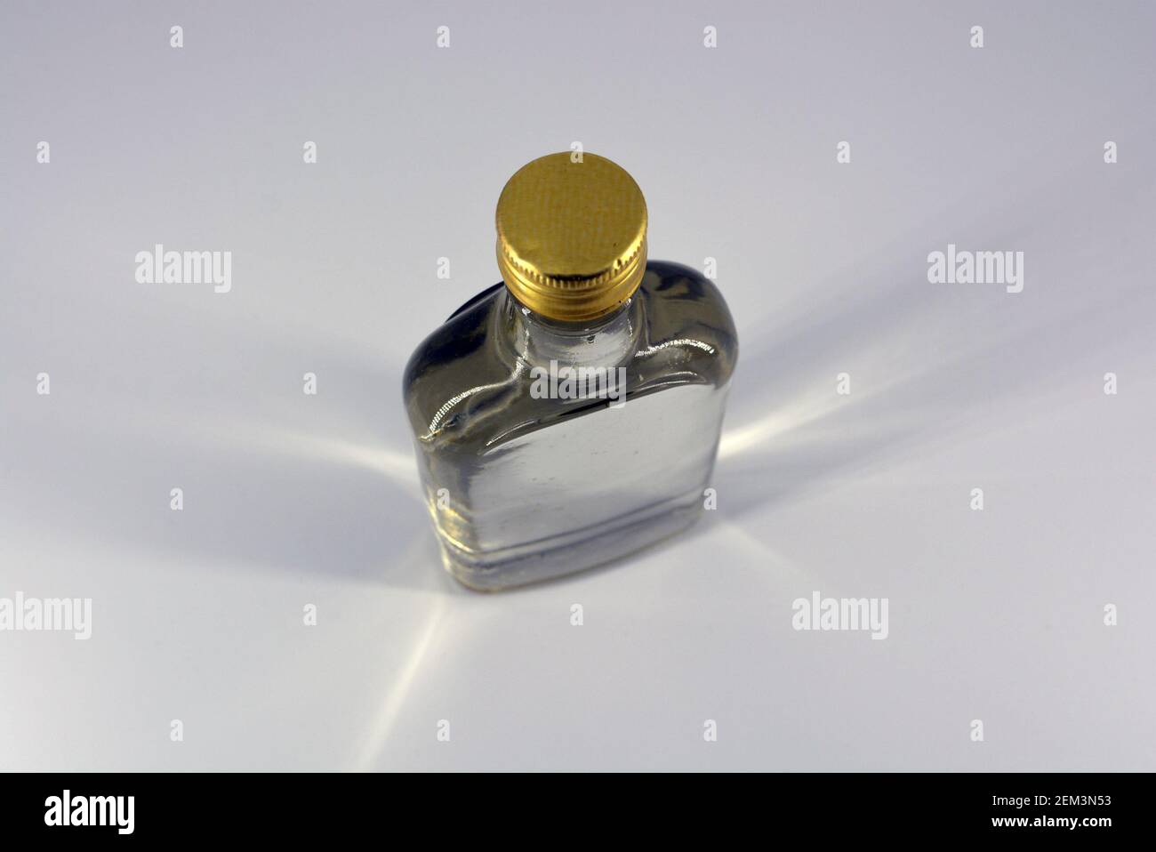 Classic glass bottle of 500 ml with swelling neck and gilded lid for ...