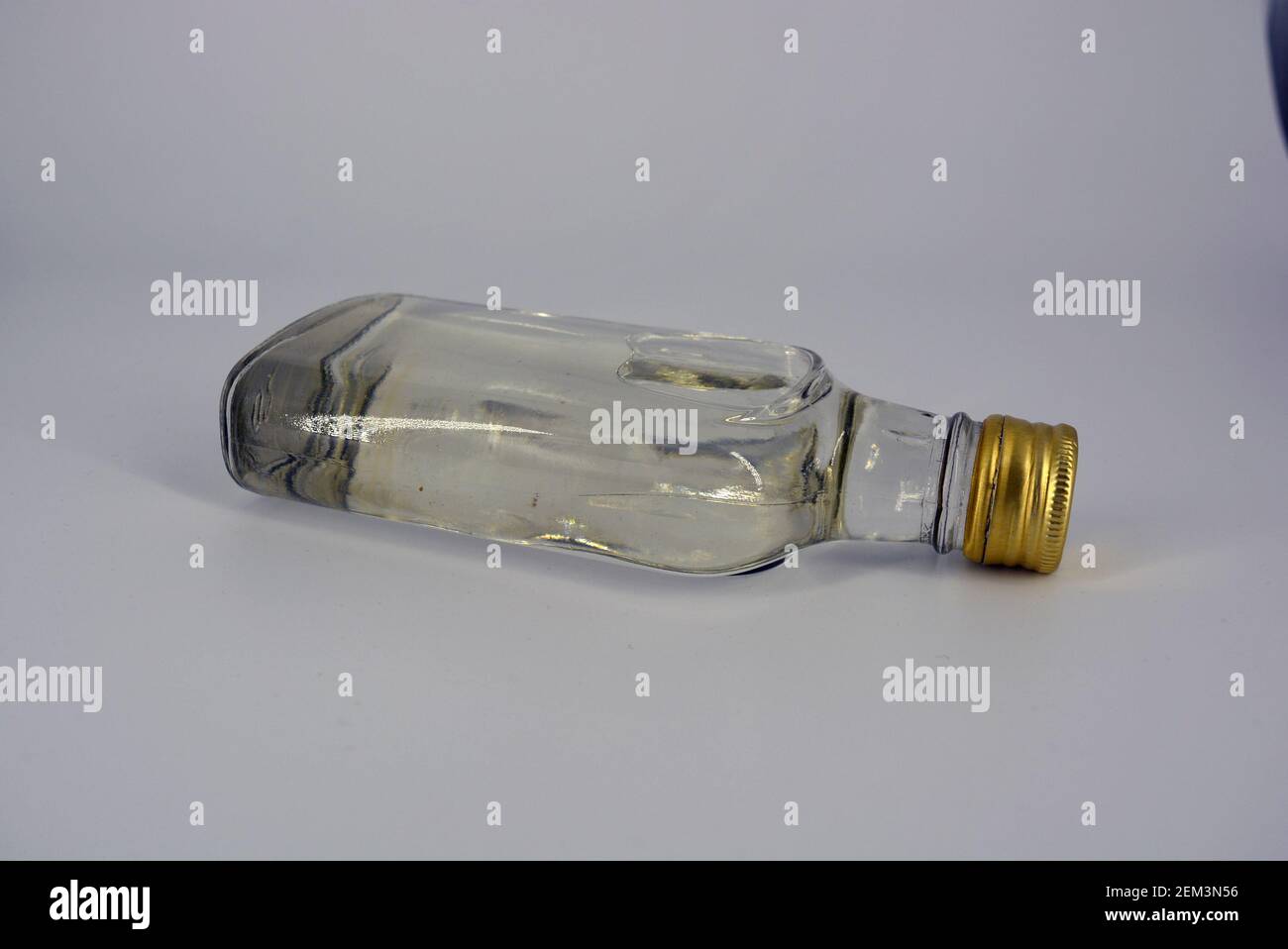 Classic glass bottle of 500 ml with swelling neck and gilded lid for ...