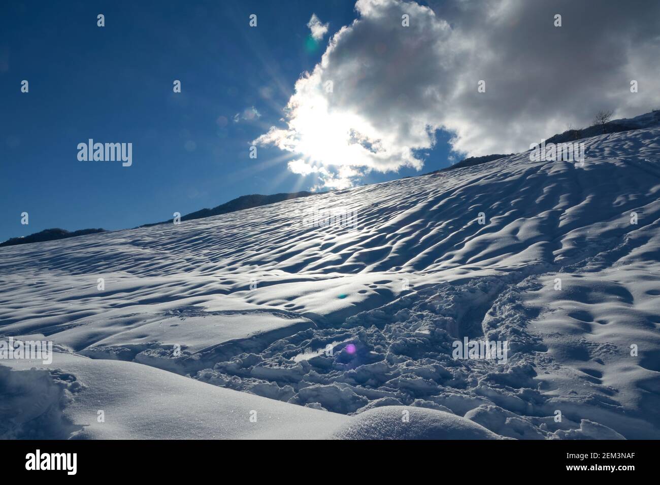 Mountains and blue sky with ice and snow of strange shapes and ...