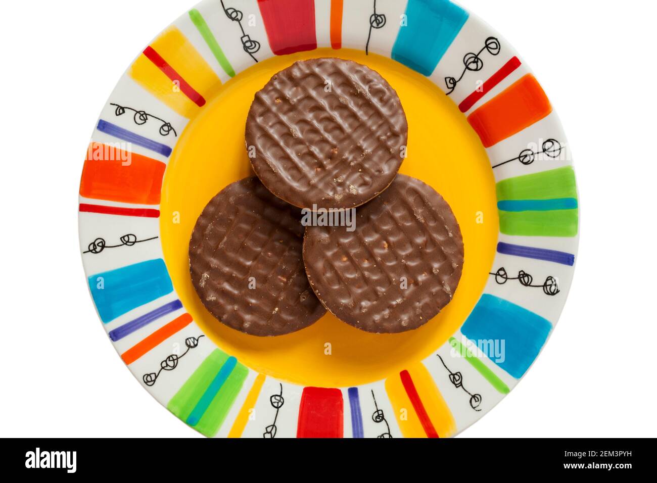 Three McVitie's milk chocolate Digestives biscuits on colourful plate ...