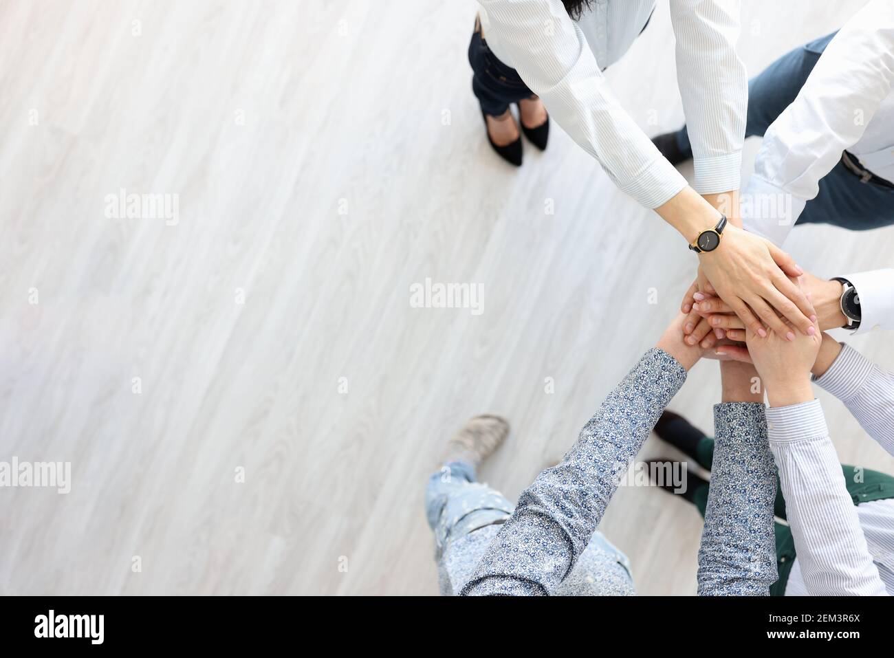 Partners stand and hold their hands in single gesture Stock Photo - Alamy