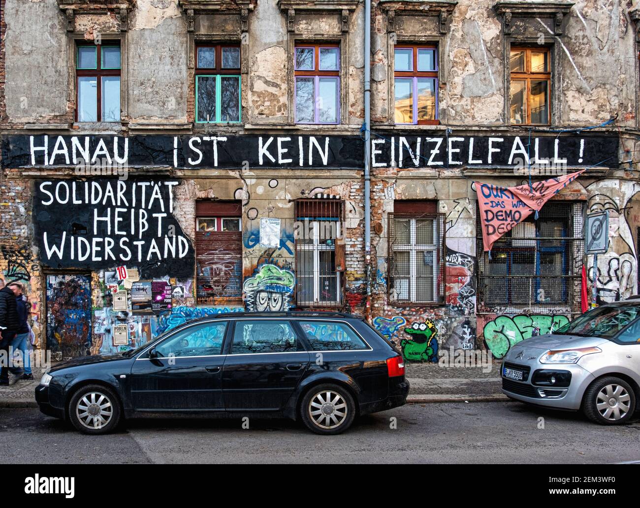 White painted message on old squat buiding on anniversary of Hanau ...