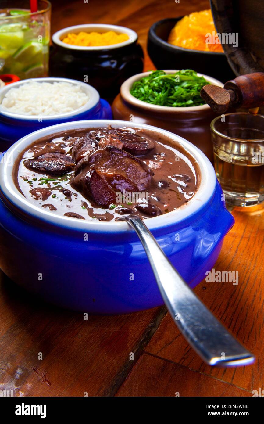 Brazilian Feijoada, traditional food with various pork meats ...