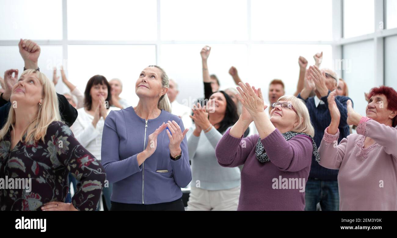 Audience applaud with raised hands in the meeting Stock Photo - Alamy