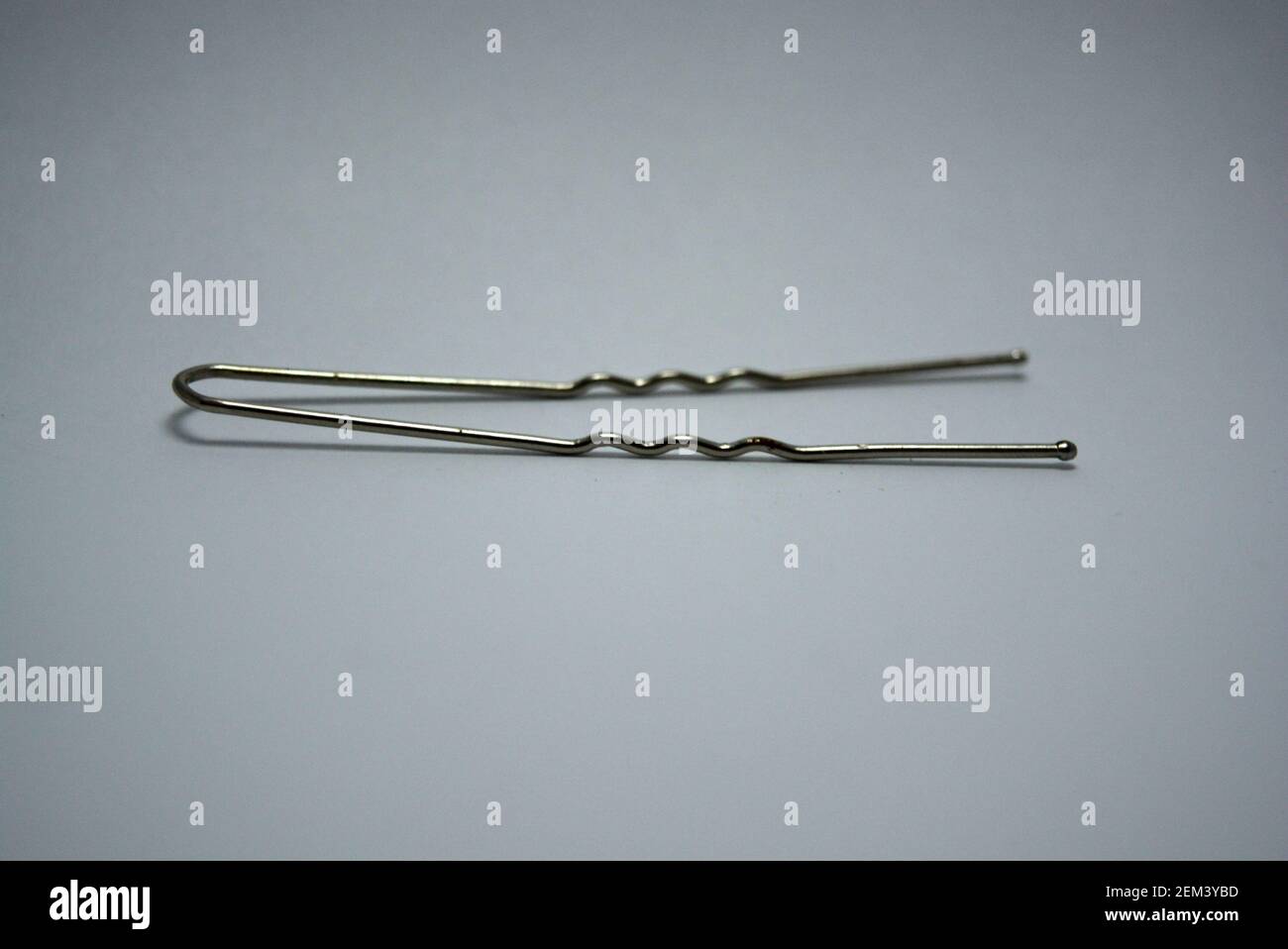 Metal female hairpin set on a white background Stock Photo - Alamy