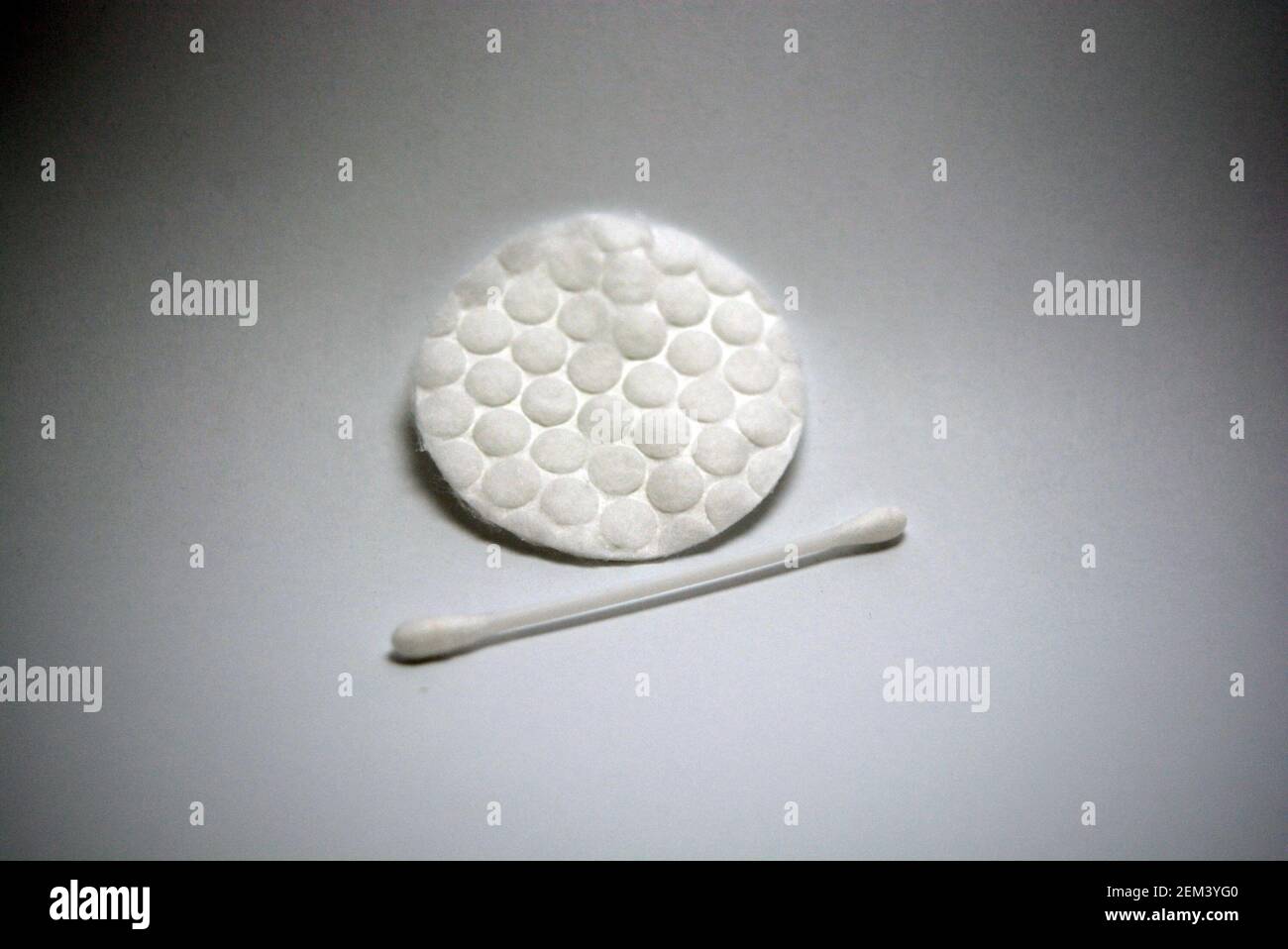 White plastic stick with cotton wool for cleaning ears and cotton swab ...