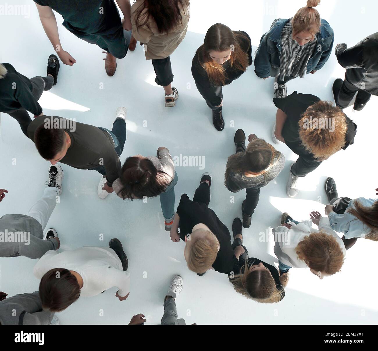 top view .groups of diverse young people moving towards each other ...