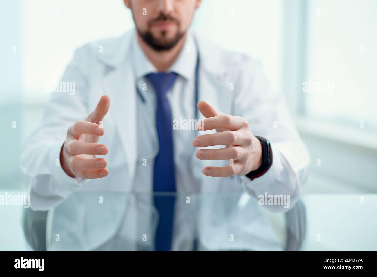 concerned male doctor explaining something to his patient Stock Photo ...