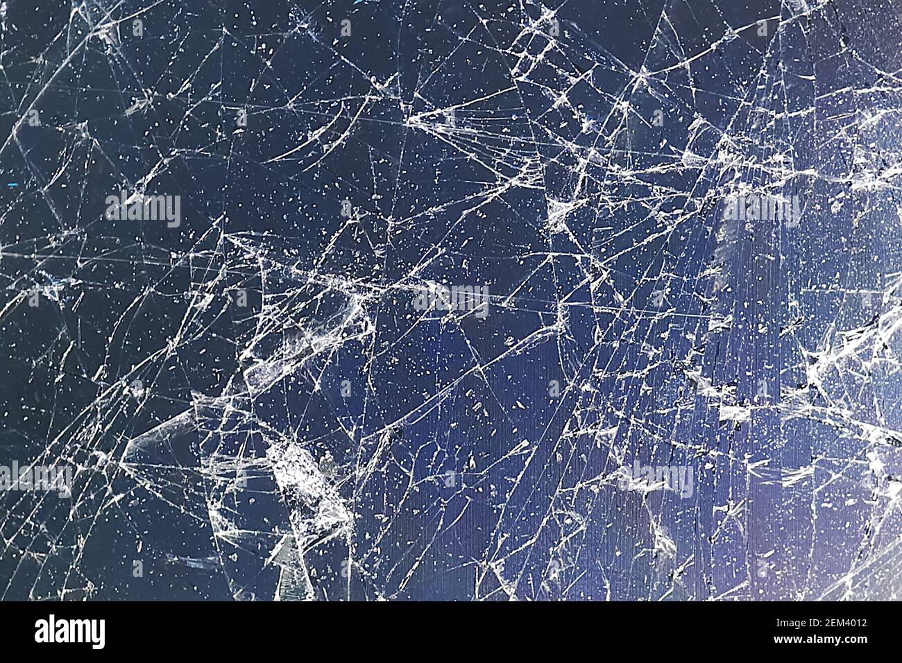 Broken glass display or cracked screen close-up. An empty, flat surface ...
