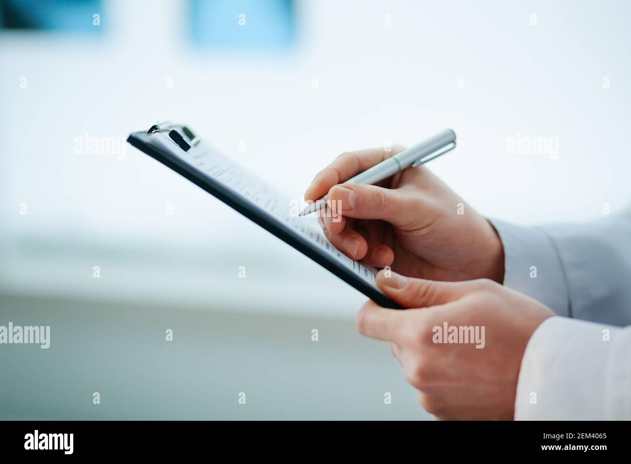 close-up. doctor filling out a medical form Stock Photo - Alamy