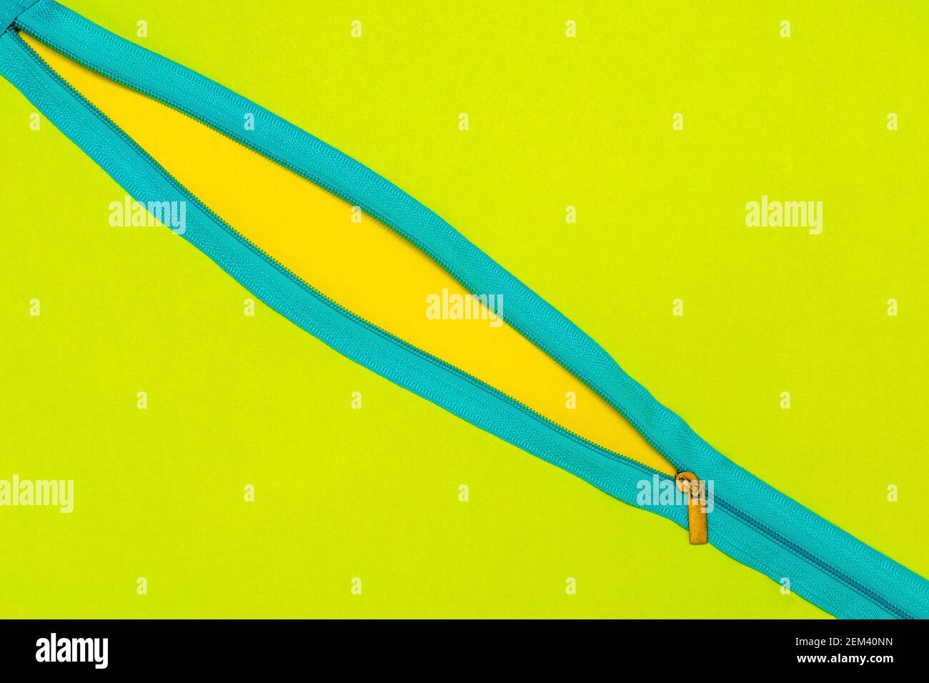 Unzipped blue zipper on colored paper background. Copy space Stock ...