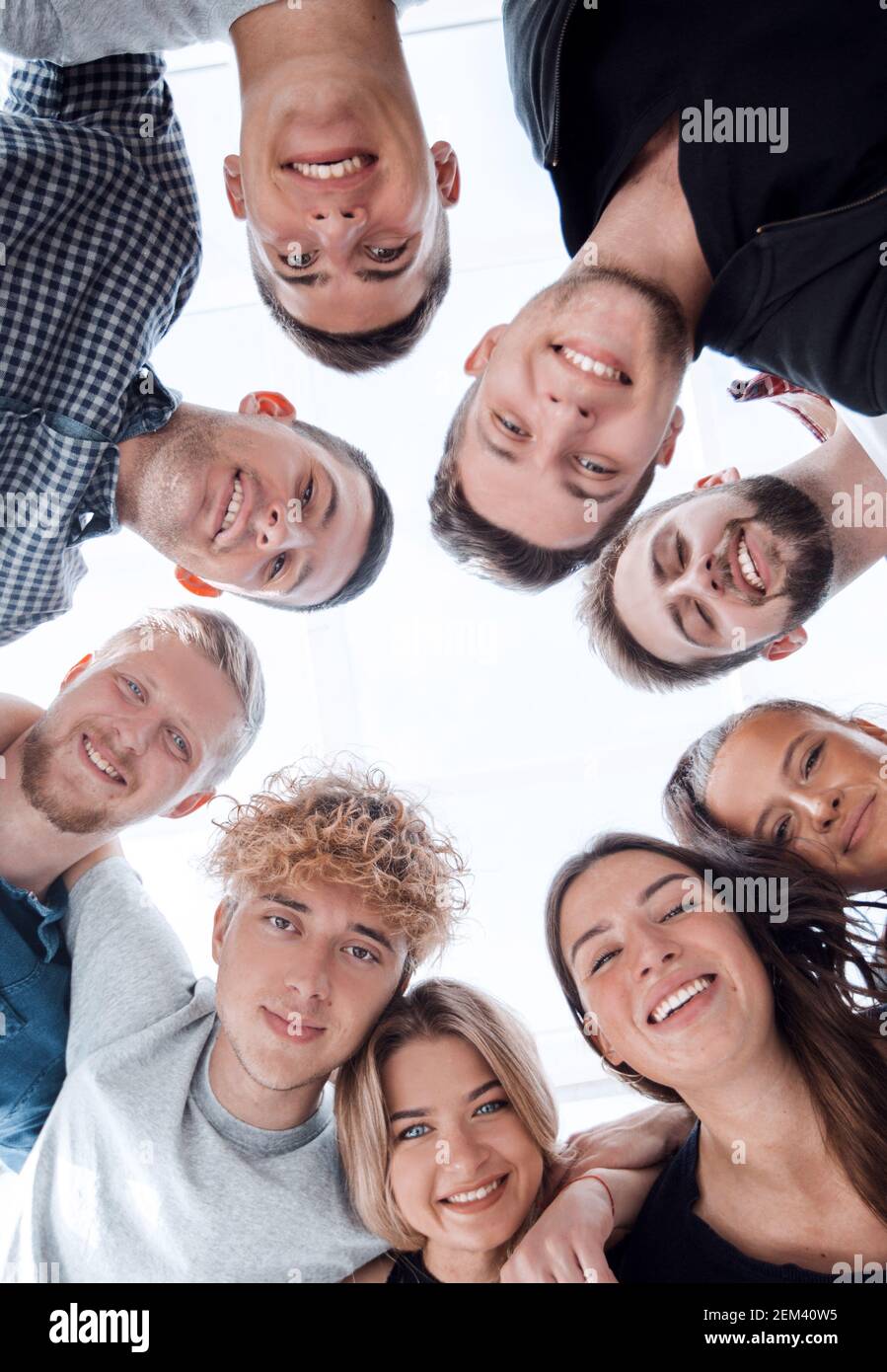 bottom view. group of diverse young people standing in a circle Stock ...