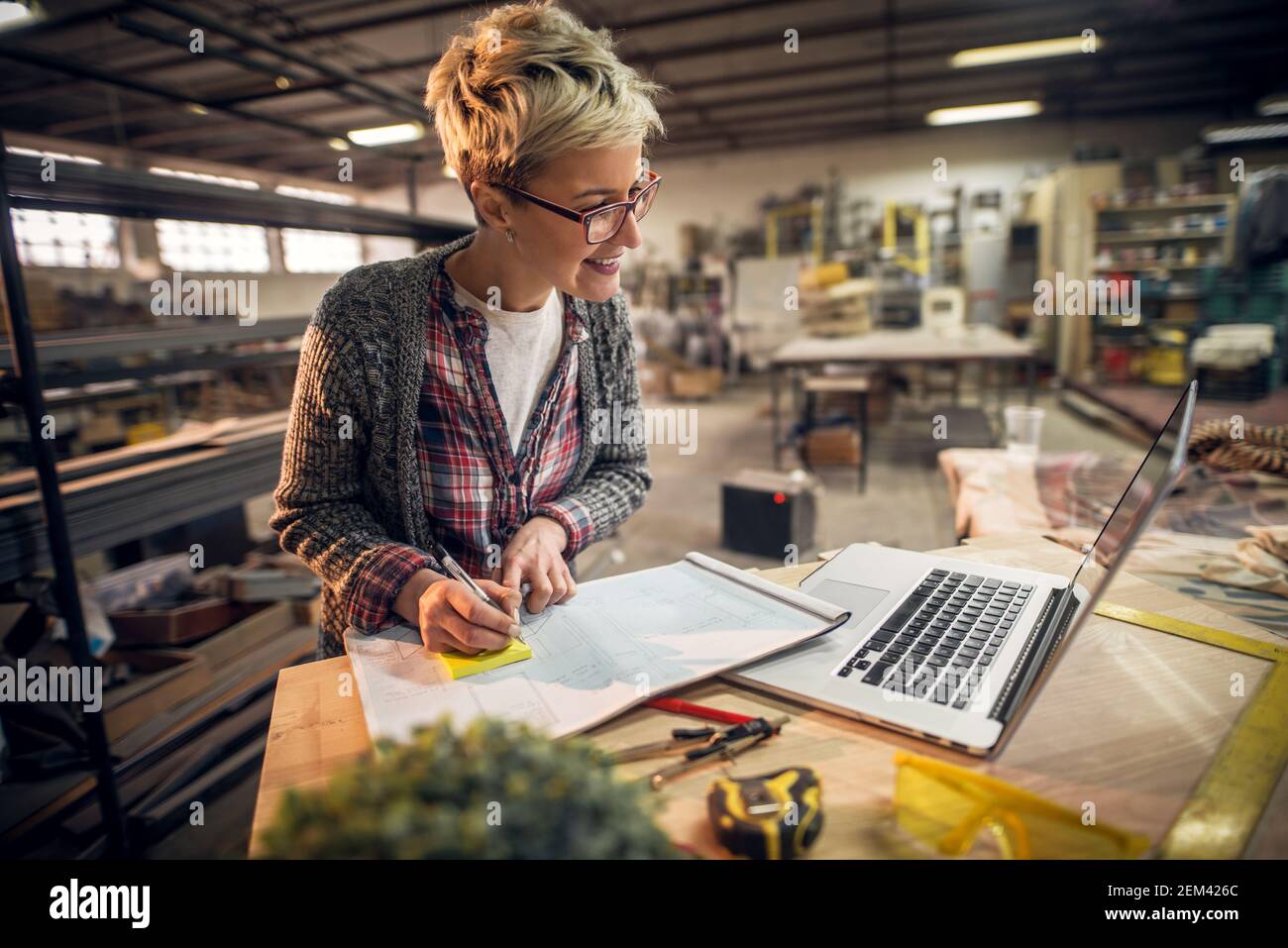 Close up view of charming smiling motivated short hair attractive ...