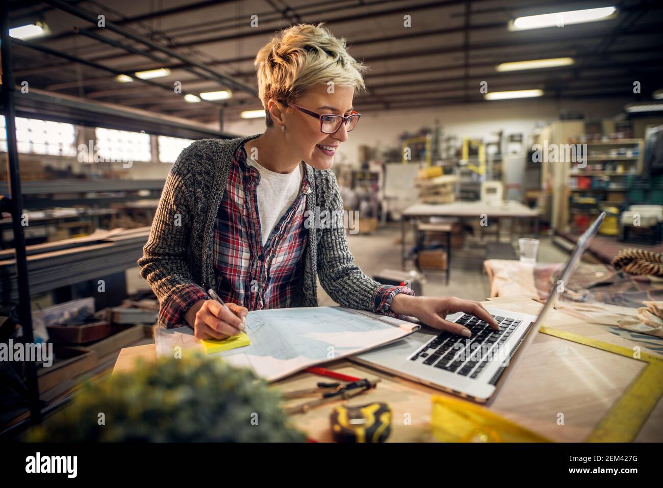 Close up view of charming smiling motivated short hair attractive ...