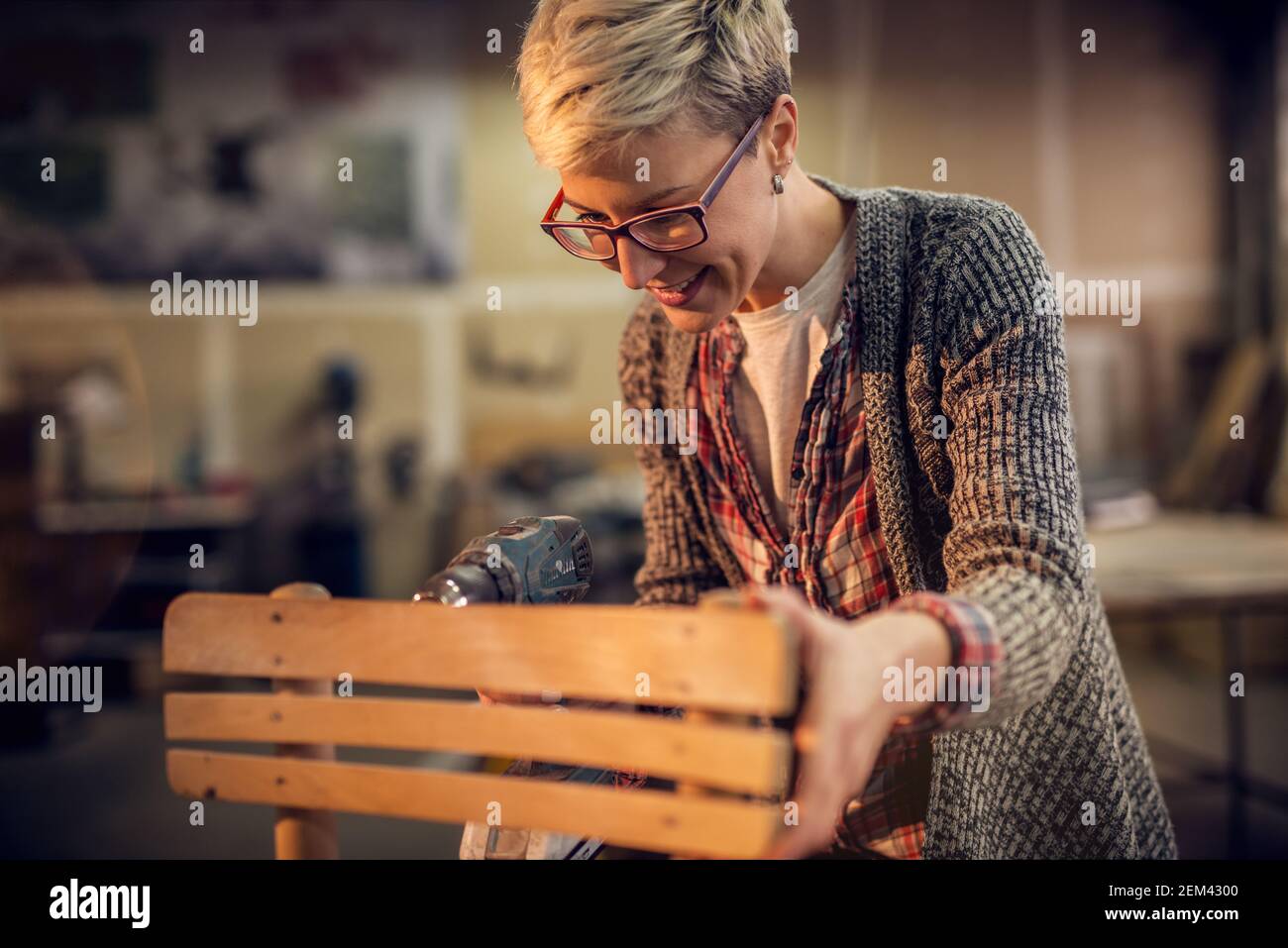 Close up view of blonde short hair hardworking middle aged woman ...