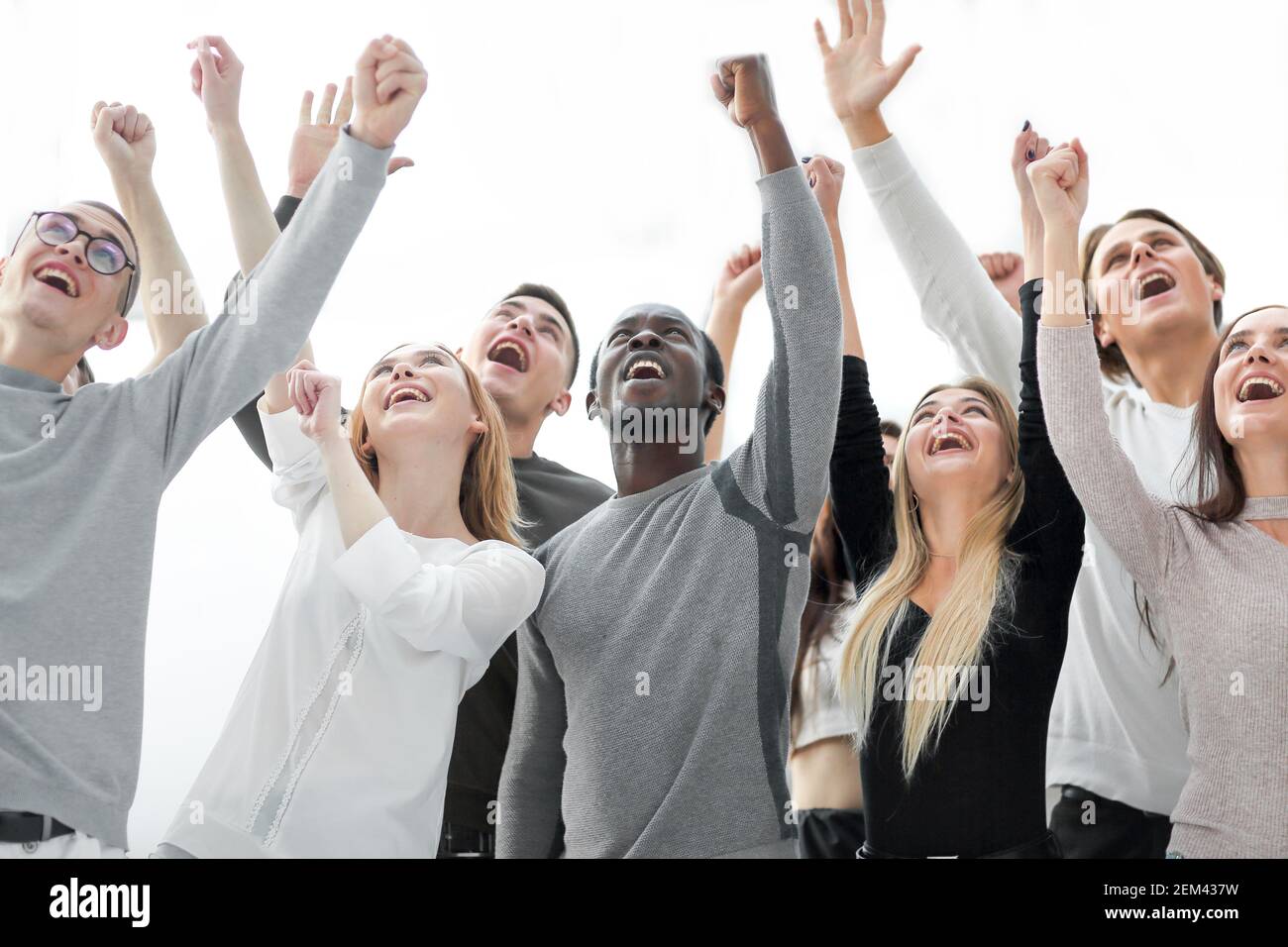 group with young people showing their succes Stock Photo - Alamy