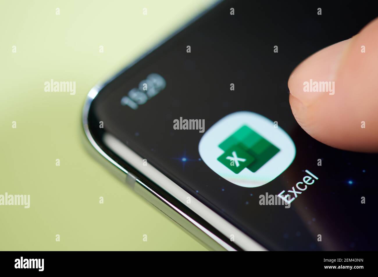New york, USA - February 24, 2021: Excel app on smartphone screen touch ...