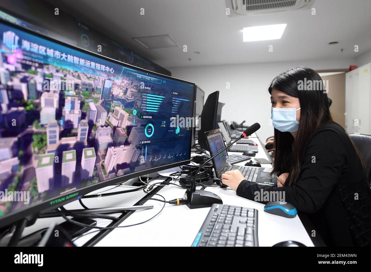 Beijing, China. 24th Feb, 2021. A staff member works at the Intelligent ...