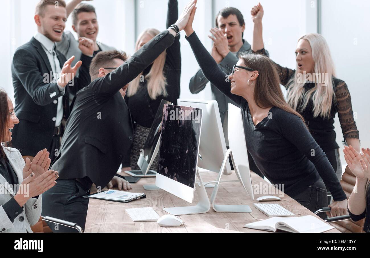 happy business team showing their success in the workplace Stock Photo ...