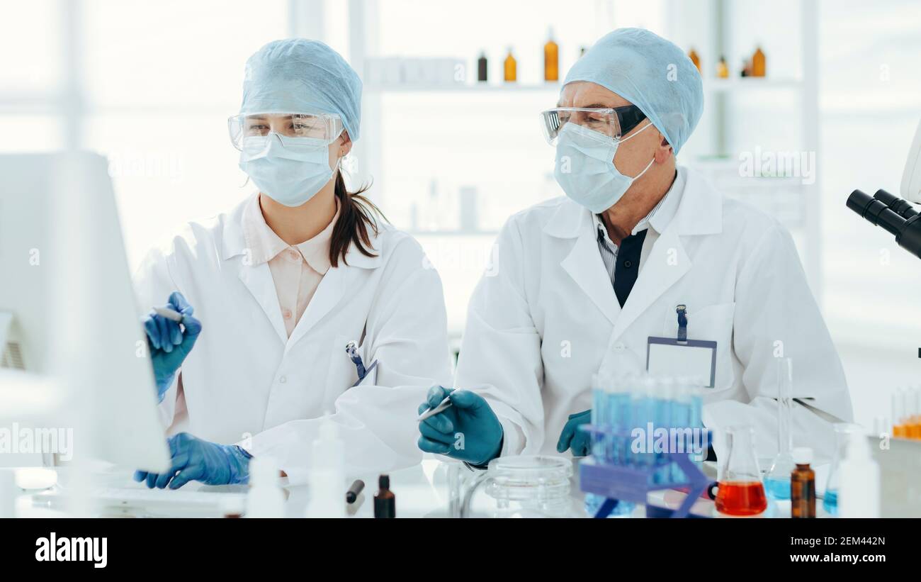 Scientists using modern computer technology hi-res stock photography ...