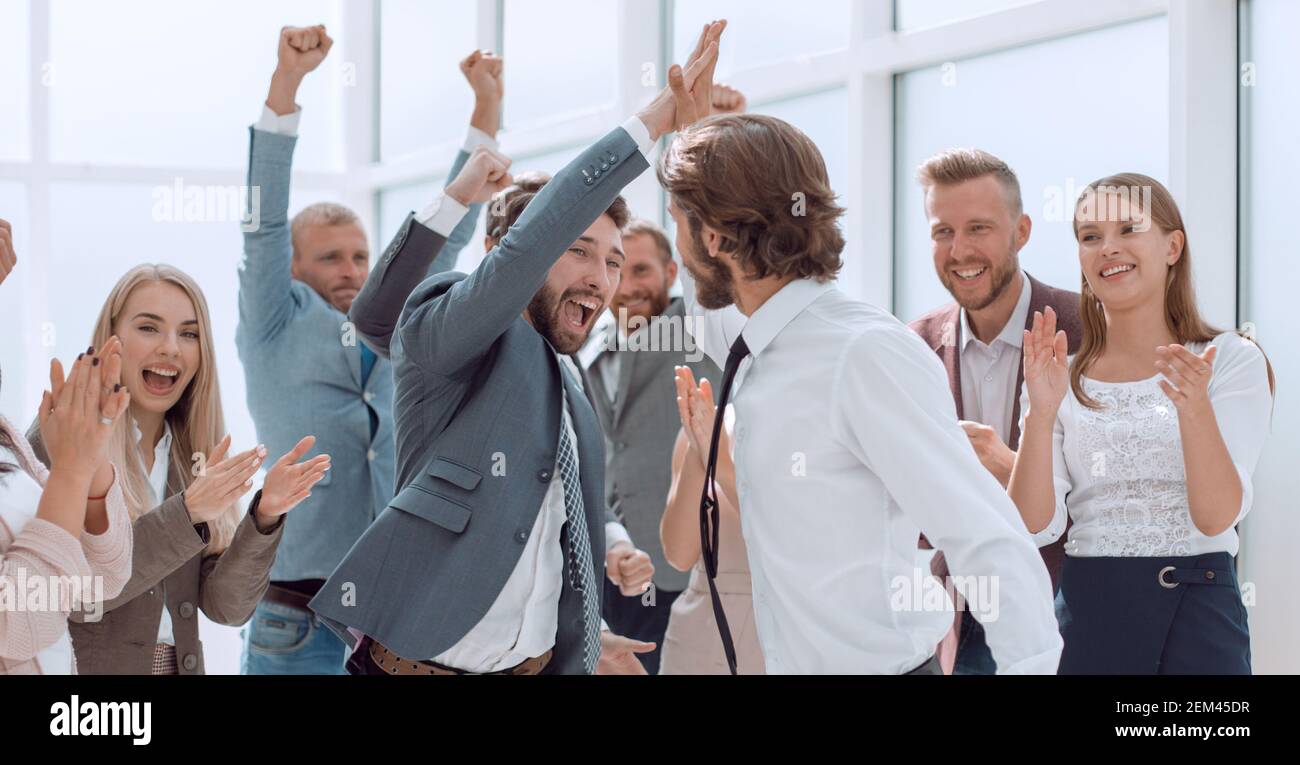business team congratulating each other on the victory Stock Photo - Alamy