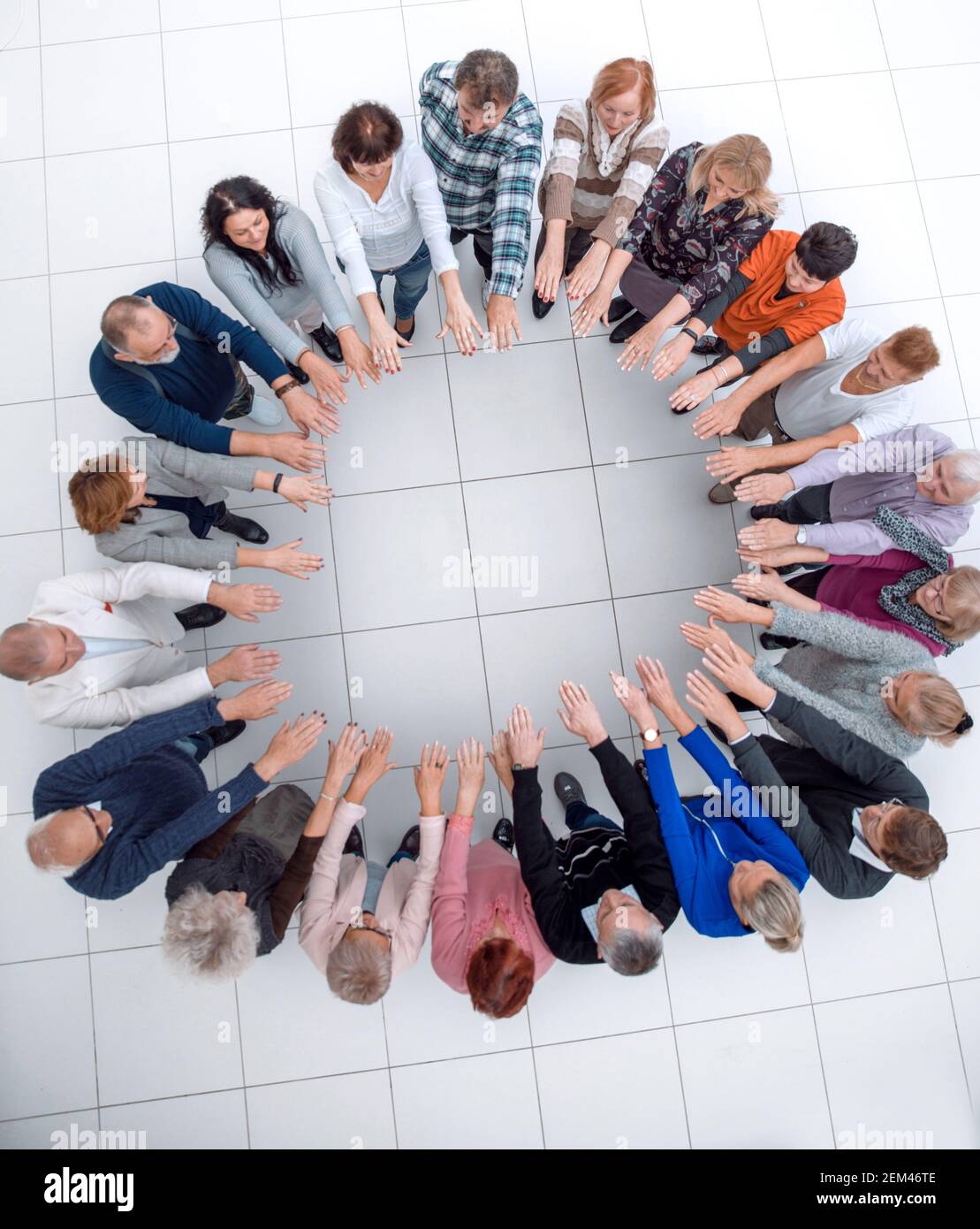 group of mature people showing their unity Stock Photo - Alamy