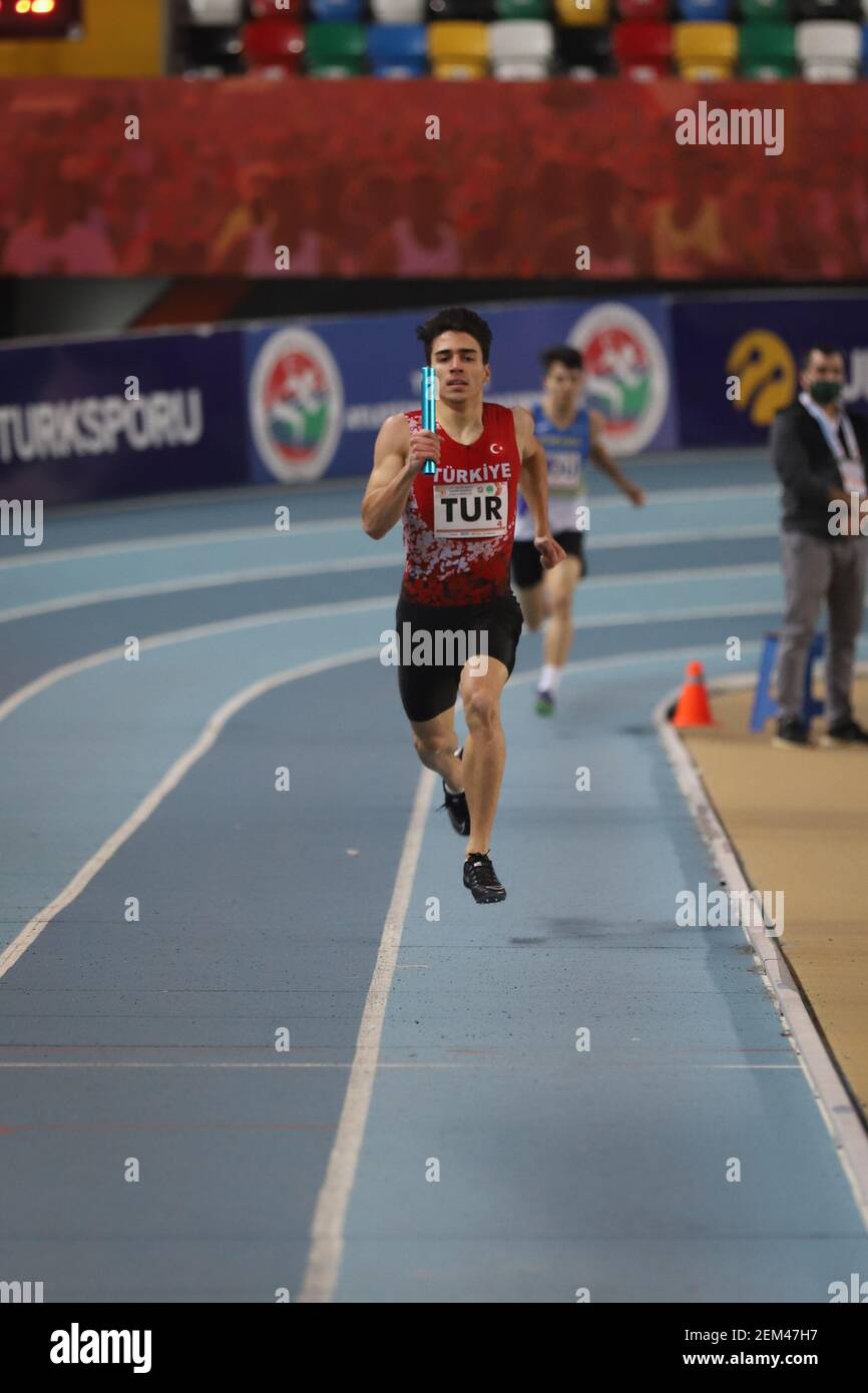 ISTANBUL, TURKEY - FEBRUARY 20, 2021: Undefined athlete running 4x400 ...