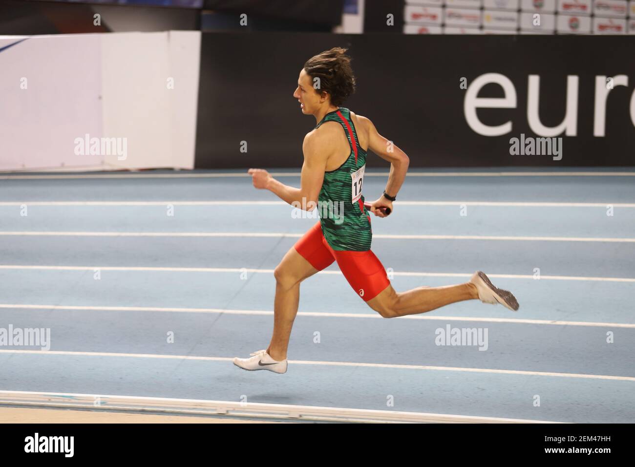 ISTANBUL, TURKEY - FEBRUARY 20, 2021: Undefined athlete running 4x400 ...