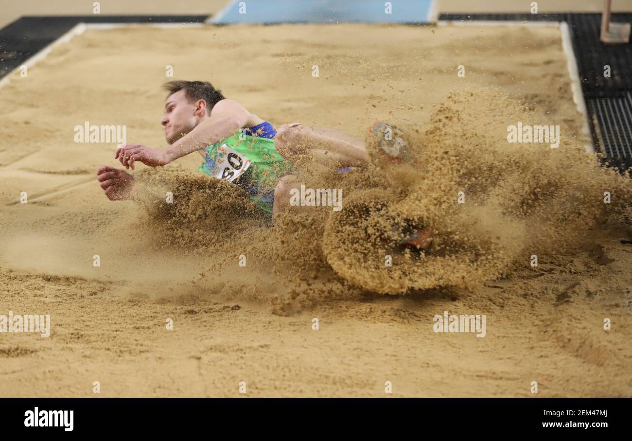 ISTANBUL, TURKEY - FEBRUARY 20, 2021: Undefined athlete long jumping ...