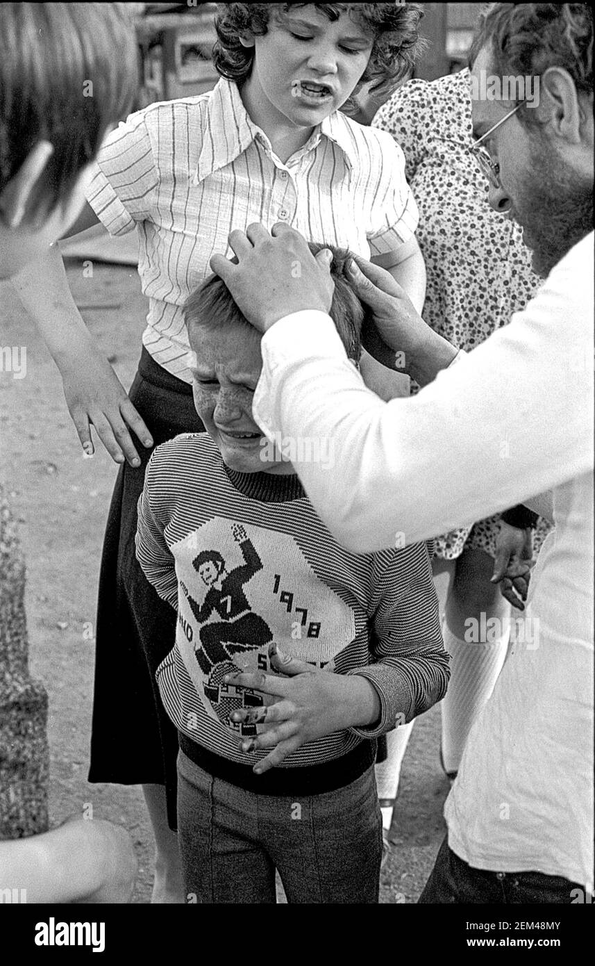 Childrens Adventure Playground injured boy crying receiving First Aid ...