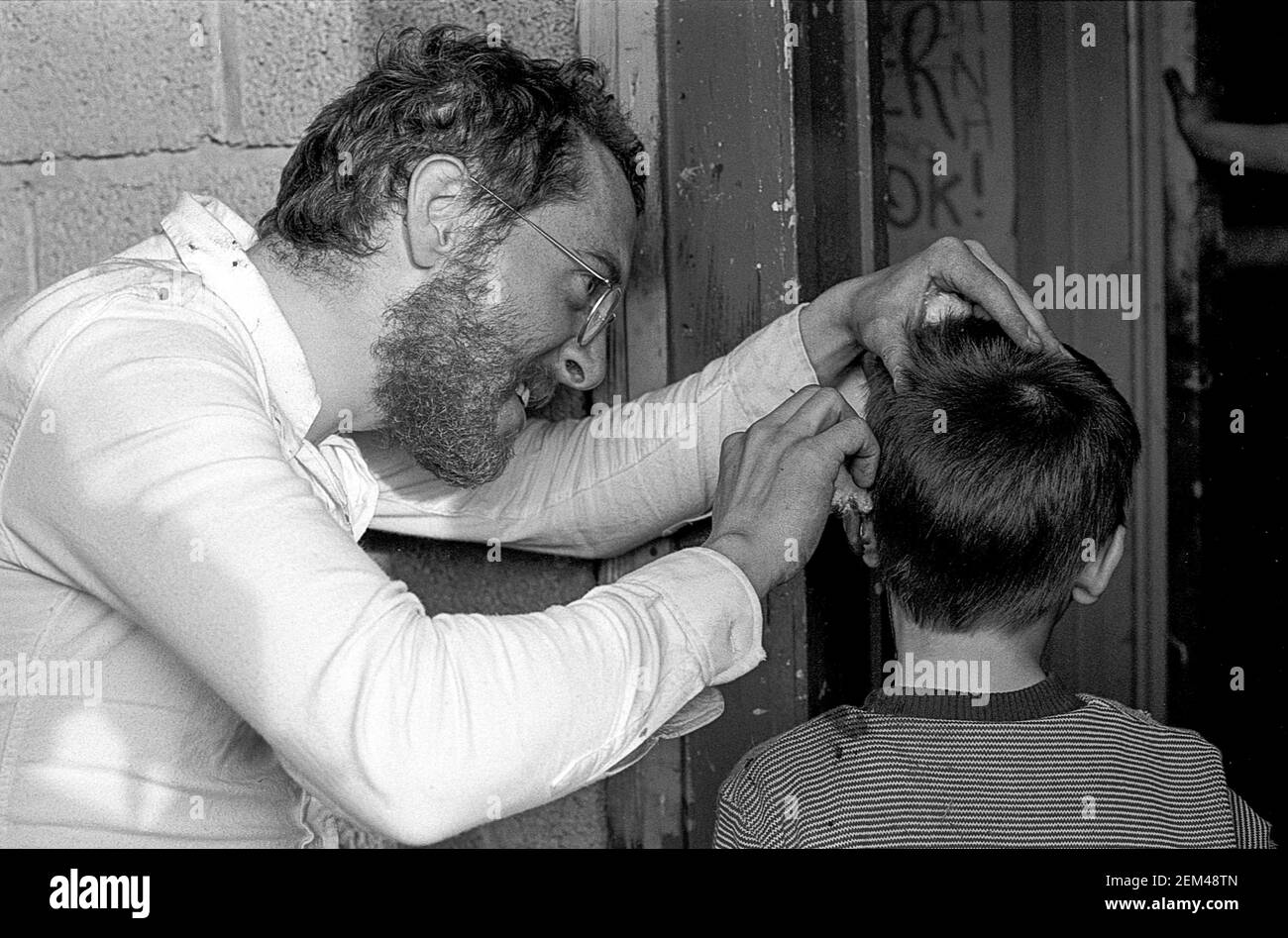 Childrens Adventure Playground Child receiving First Aid by supervisor ...