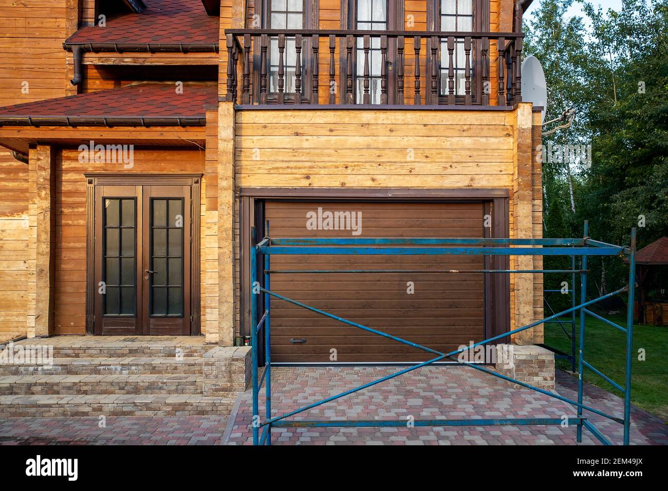 Modern wooden timber eco house villa facade during process of ...