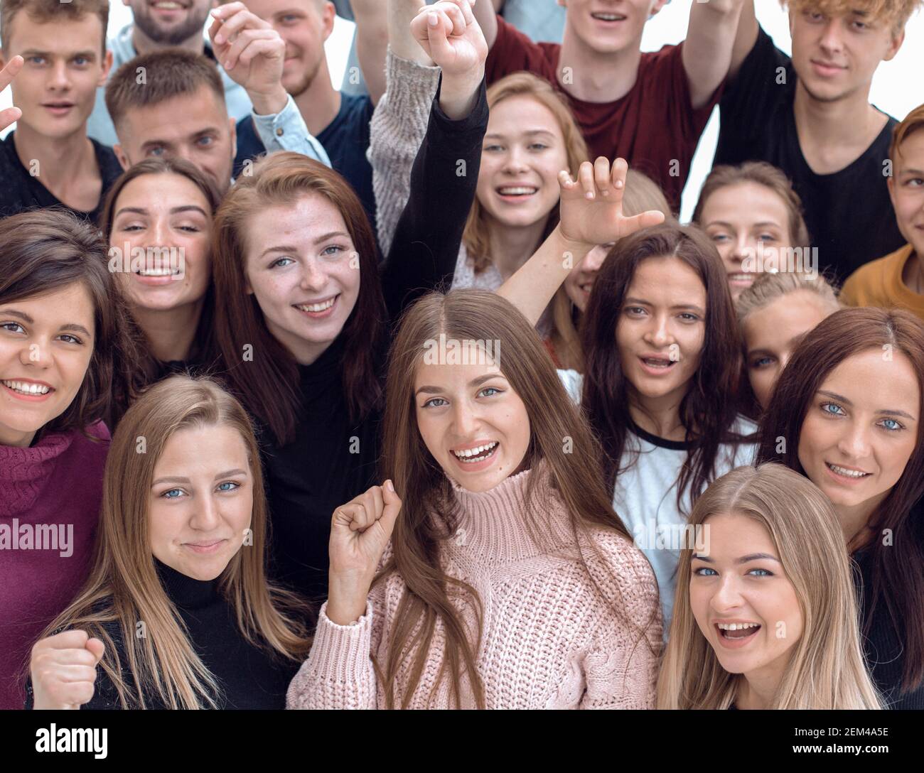 large group of happy young people looking at the camera Stock Photo - Alamy