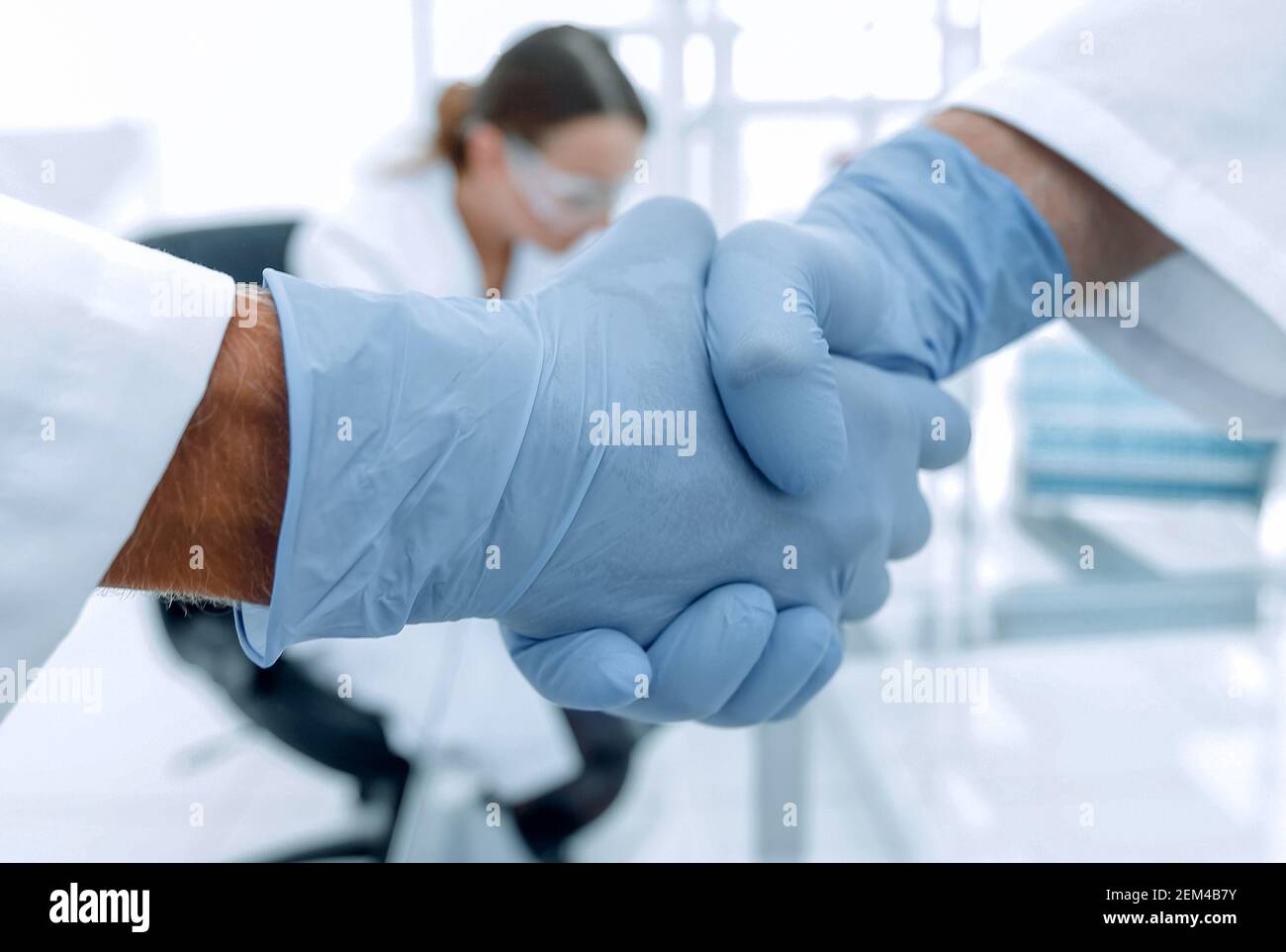 hand in the medical glove (handshake Stock Photo - Alamy