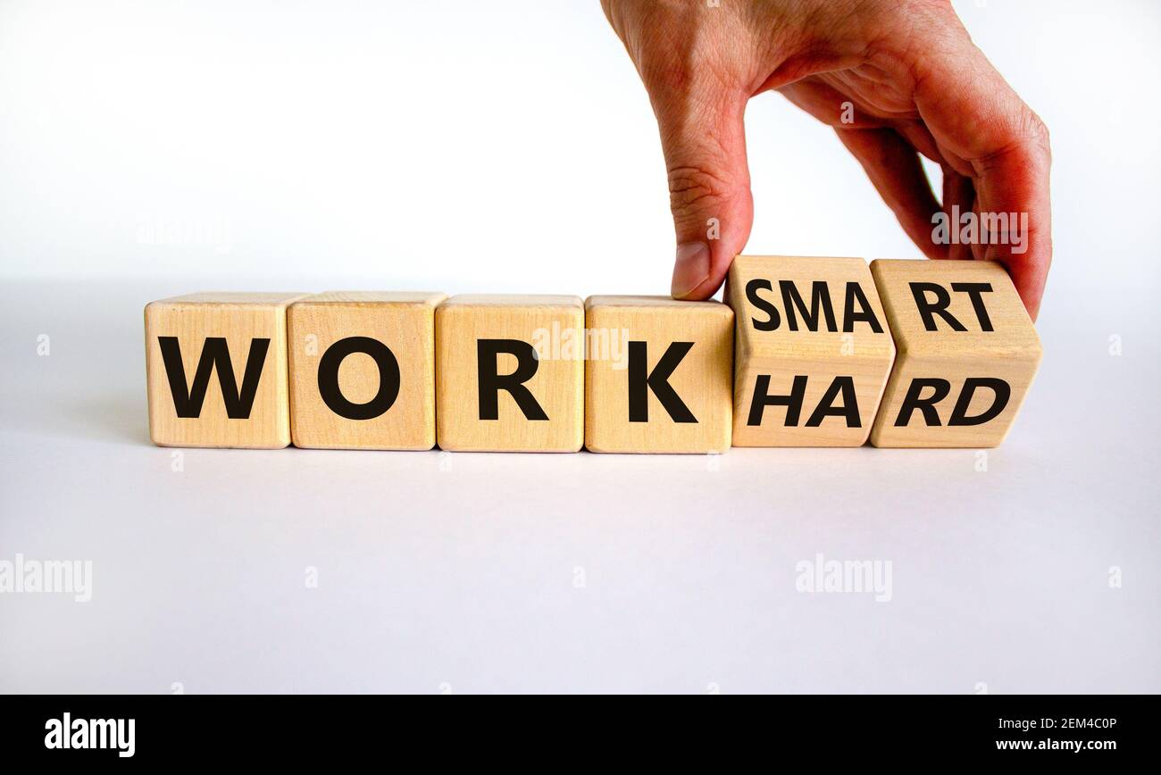 Work hard or smart symbol. Businessman turns wooden cubes and changes ...
