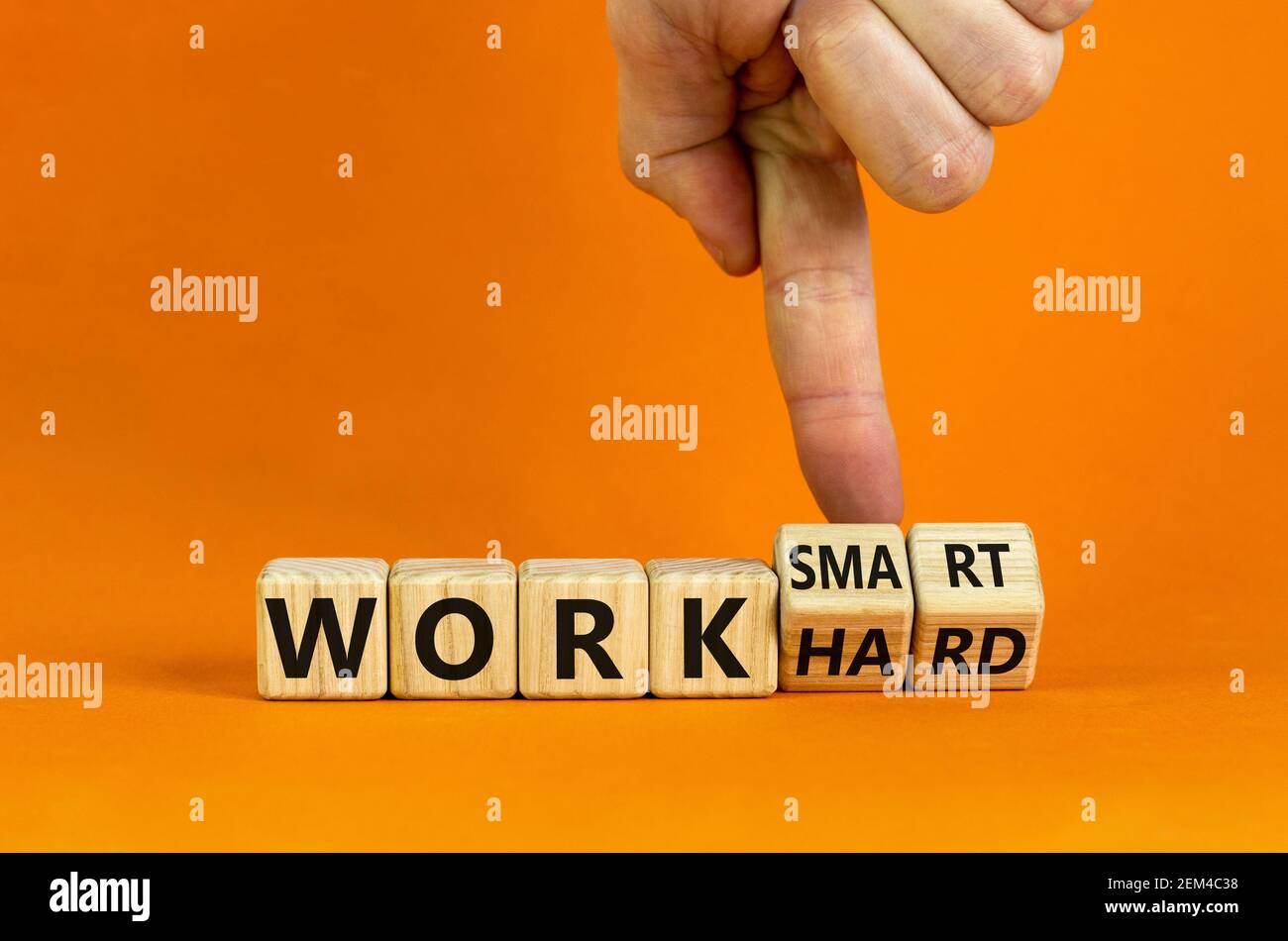 Work hard or smart symbol. Businessman turns wooden cubes and changes ...