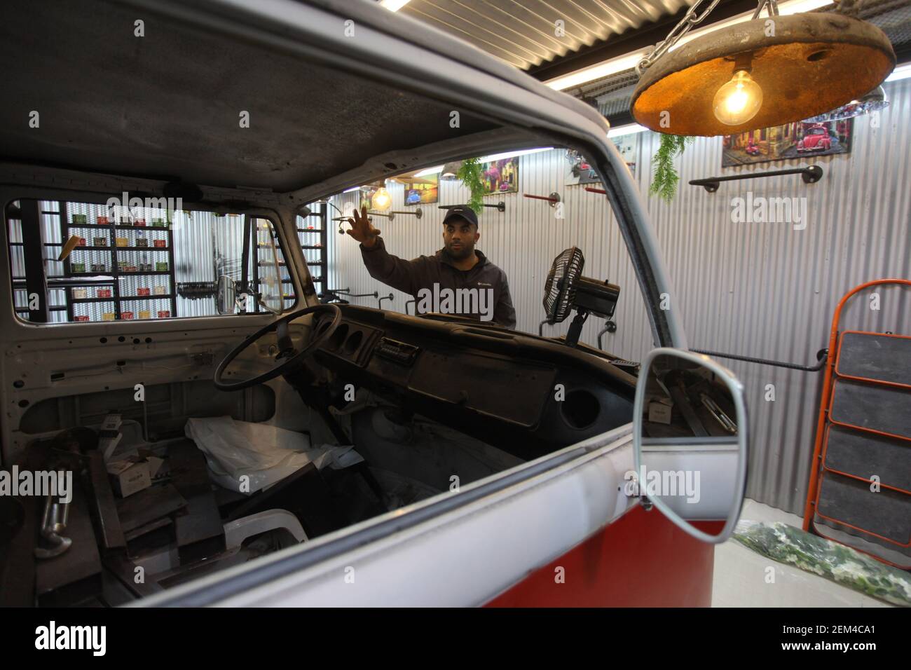 Jenin. 24th Feb, 2021. Mahmoud Rahal displays artwork that he made out ...