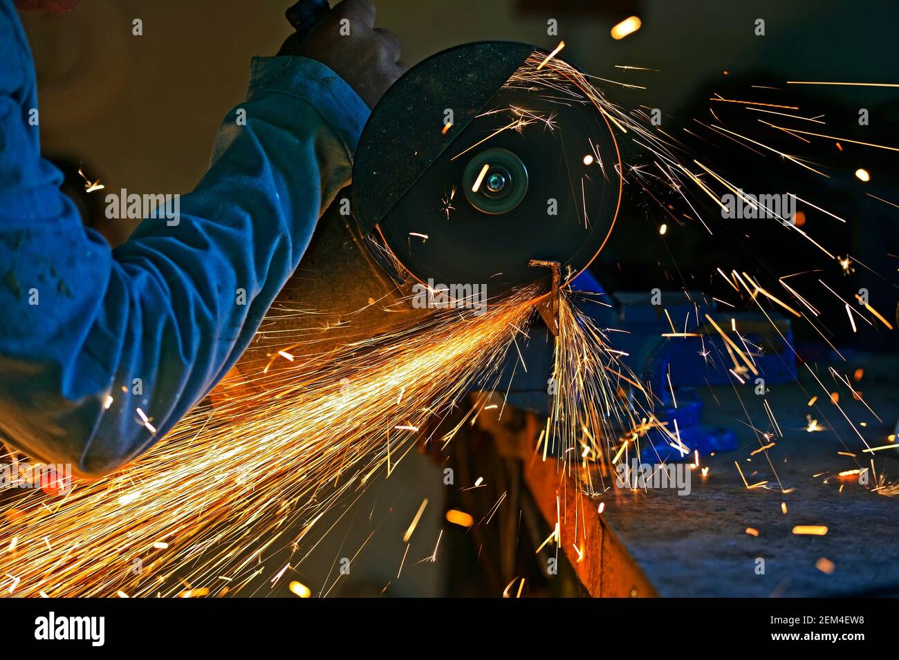 Red hot sparks at grinding steel material Stock Photo - Alamy