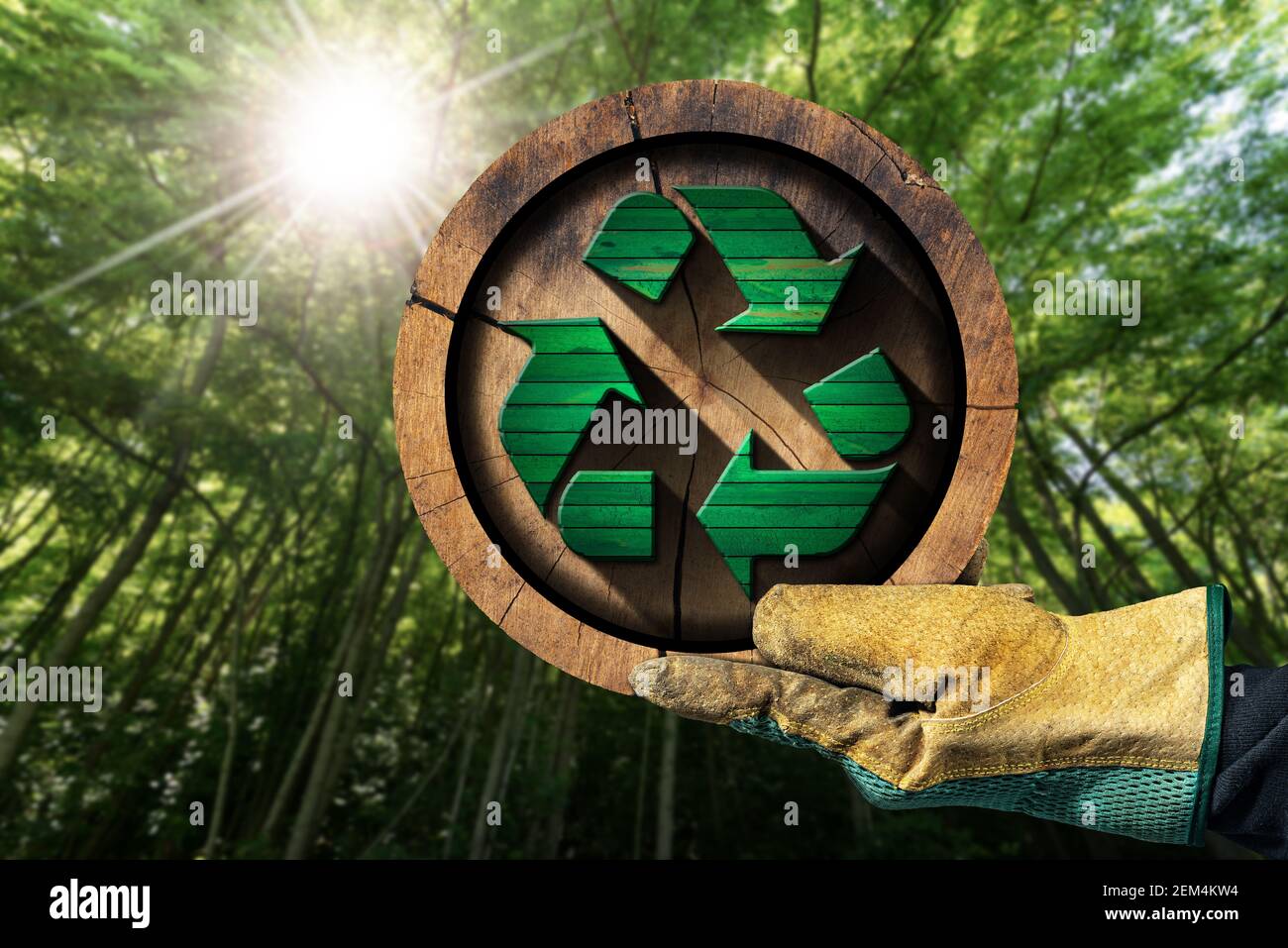 Hand with protective work glove showing a recycling symbol made of ...