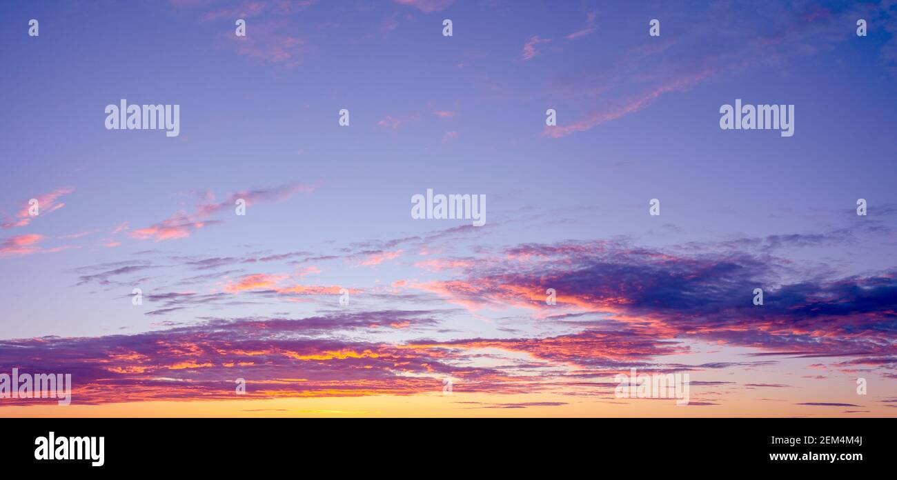Colorful sunset sky background with light of setting sun behind Stock ...