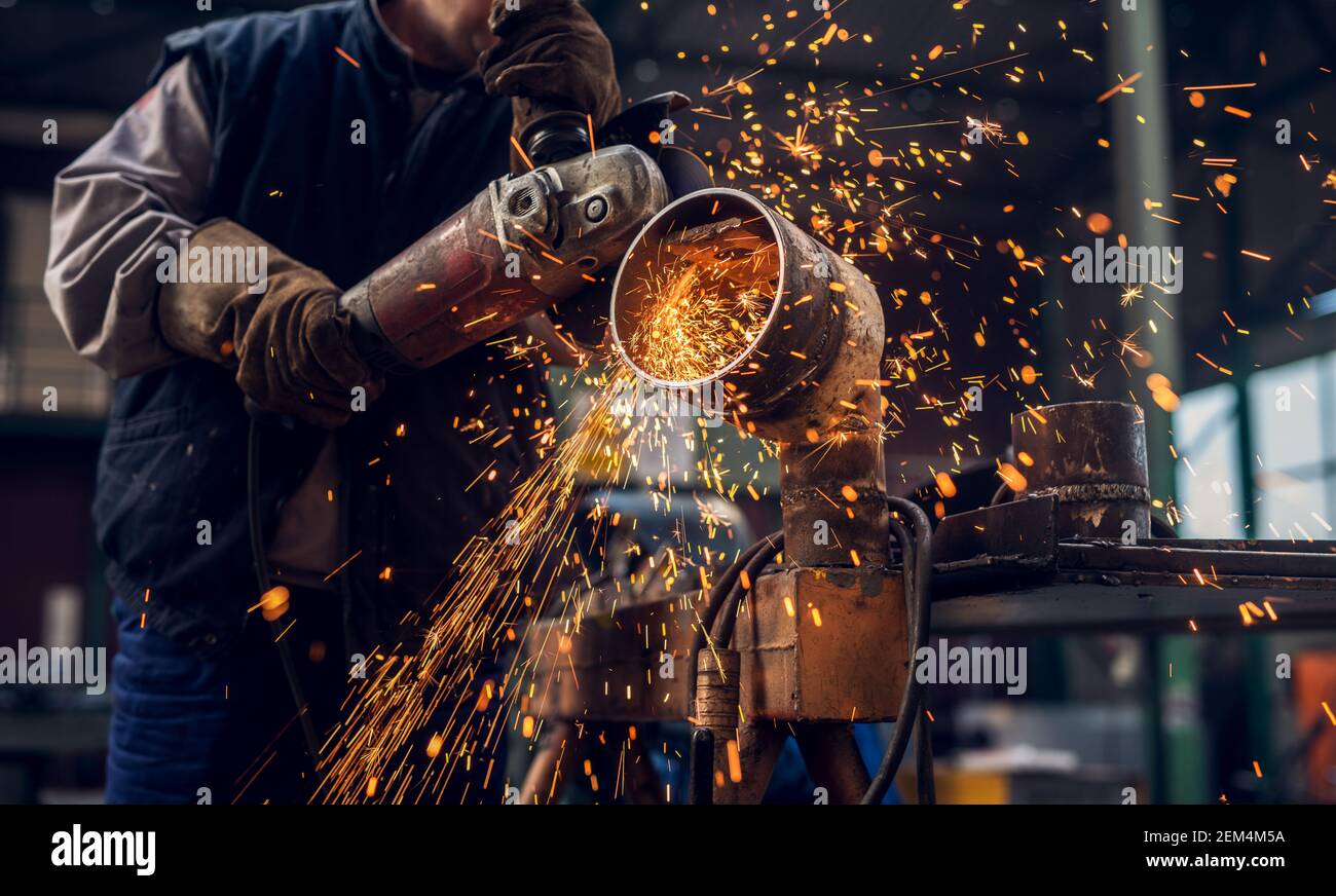 Side close up view of professional focused worker man in uniform ...