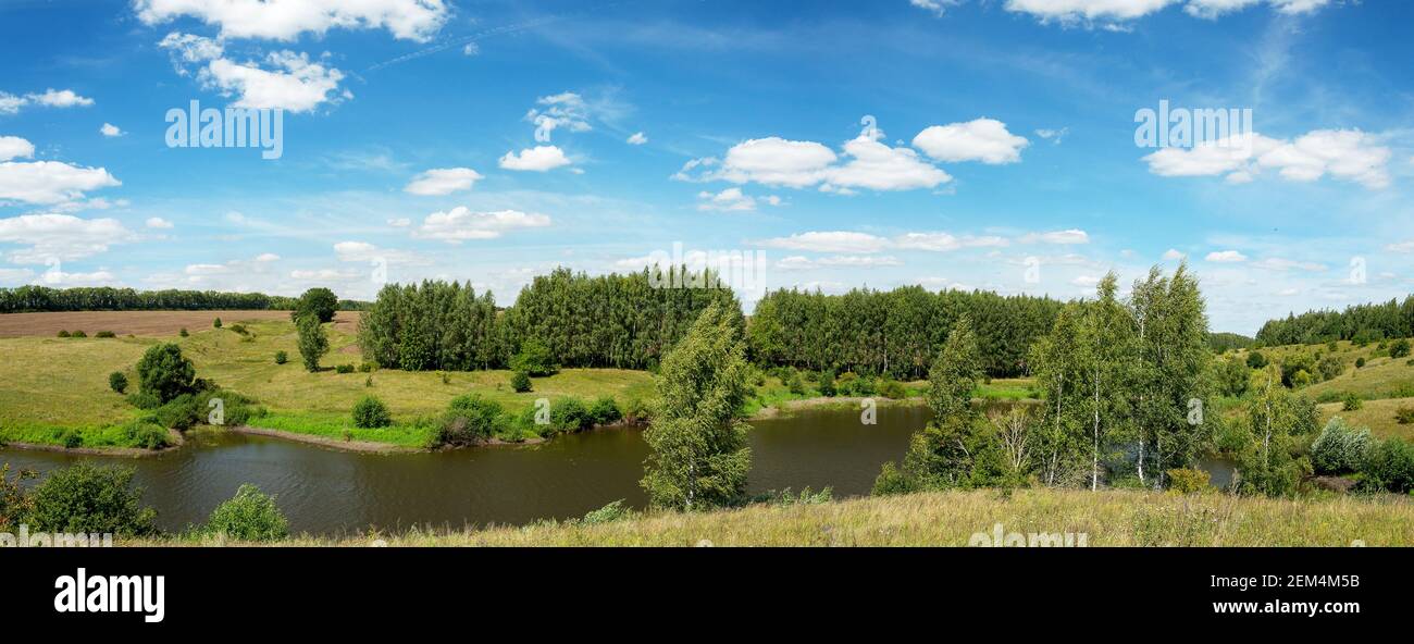 Sunny summer landscape with green hills,river and beautiful woods ...