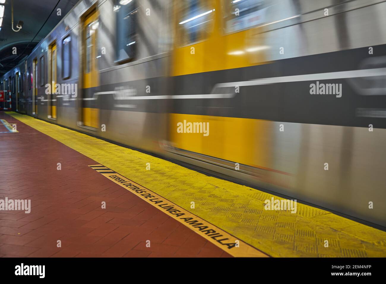 long exposure of a subway underground train in a metro station with ...